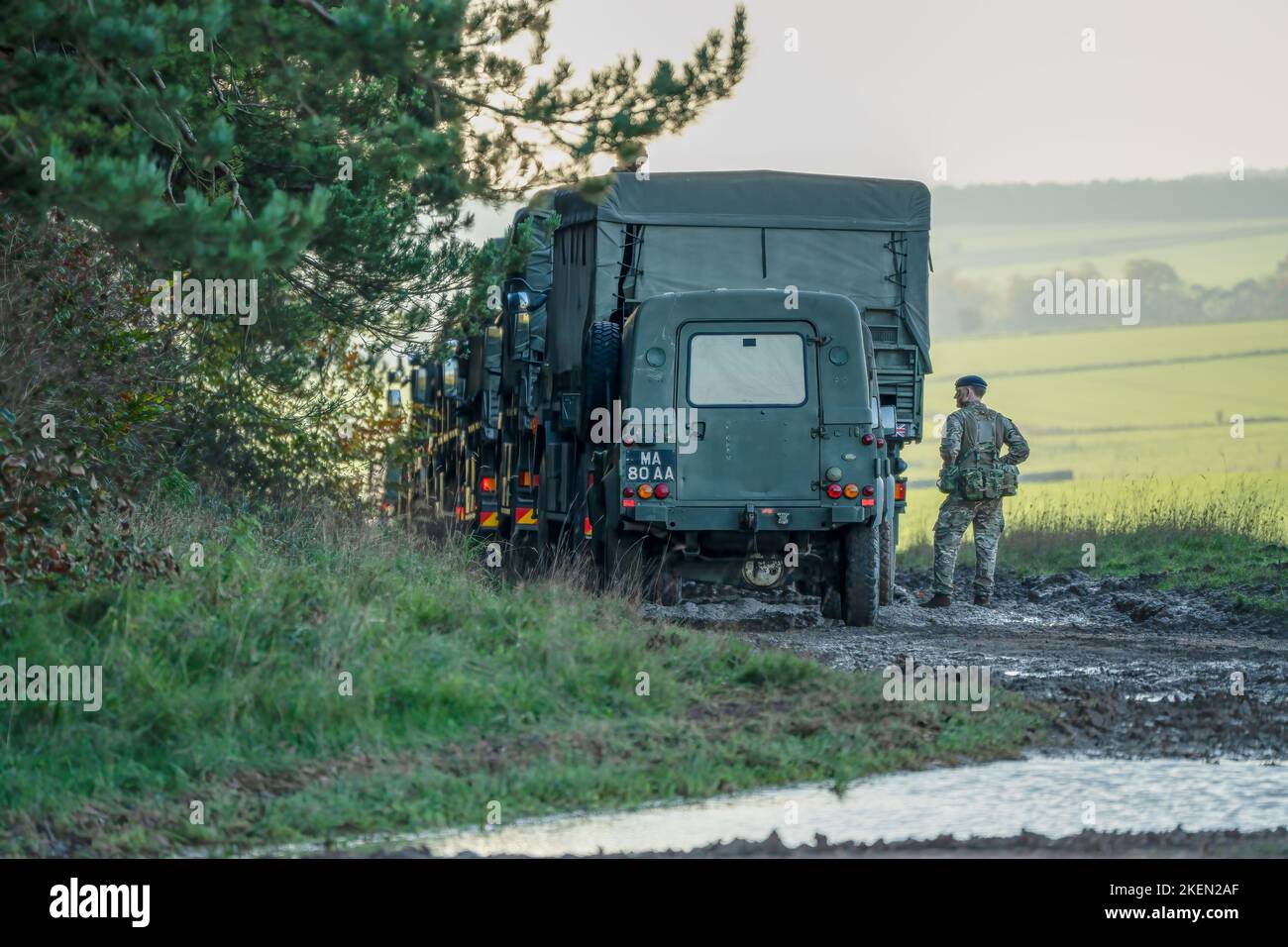 Britrish army Defender Wolf and MAN SV 4x4 Utility Trucks queued along ...