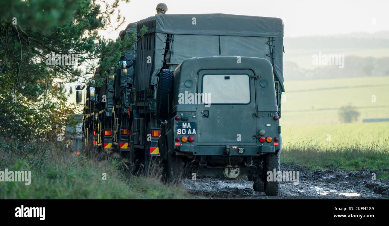 Britrish army Defender Wolf and MAN SV 4x4 Utility Trucks queued along ...