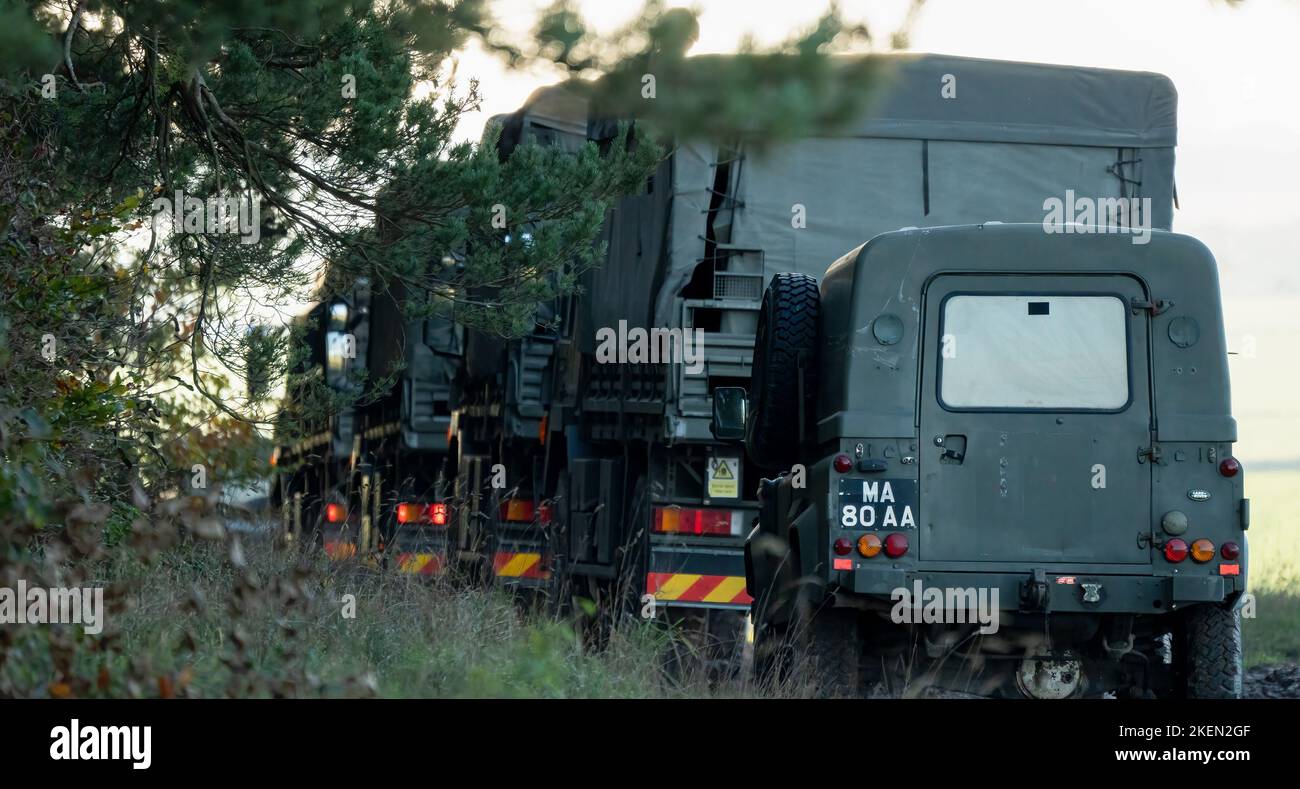 Britrish army Defender Wolf and MAN SV 4x4 Utility Trucks queued along ...