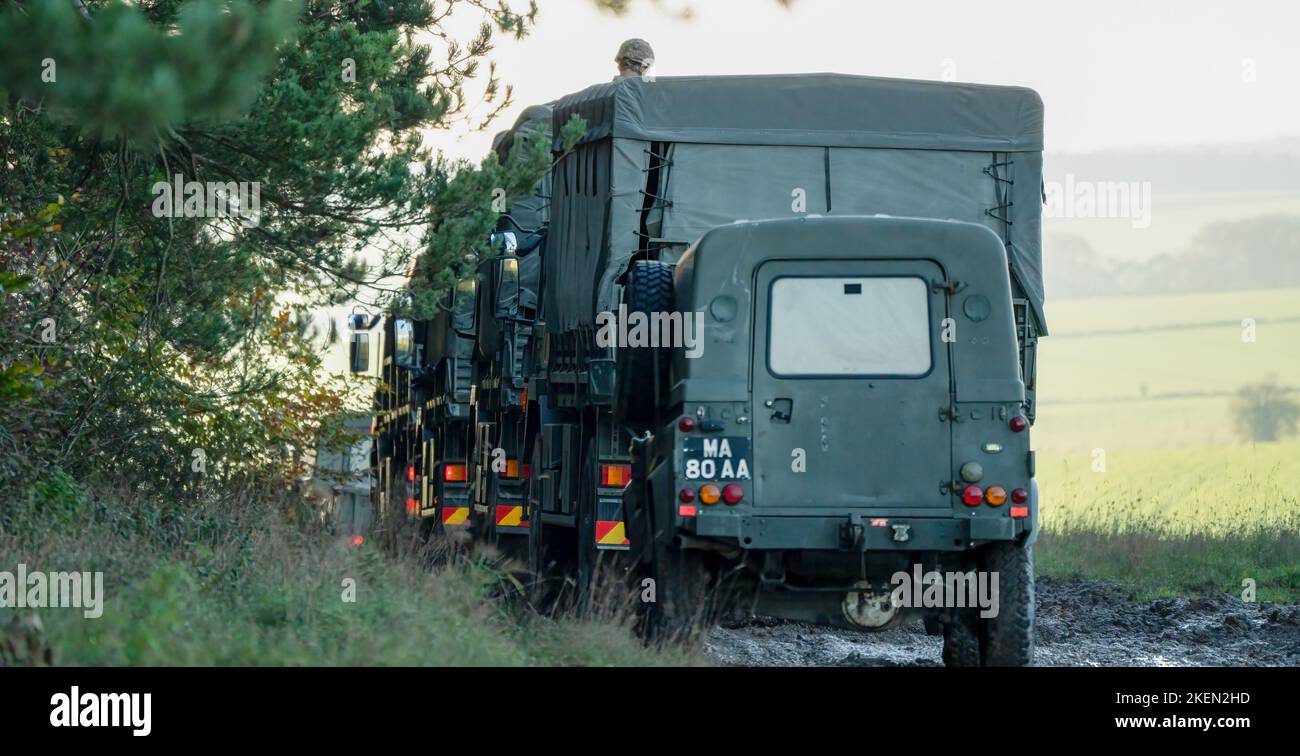 Britrish army Defender Wolf and MAN SV 4x4 Utility Trucks queued along ...
