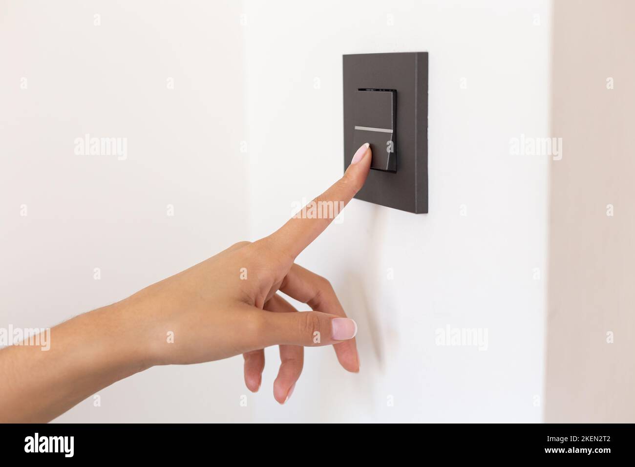 Womans hand light switch hi-res stock photography and images - Alamy