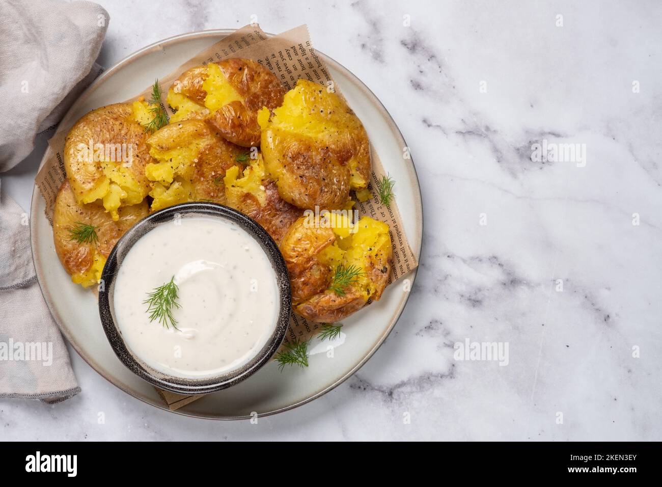 smashed potato on parchment paper Stock Photo - Alamy