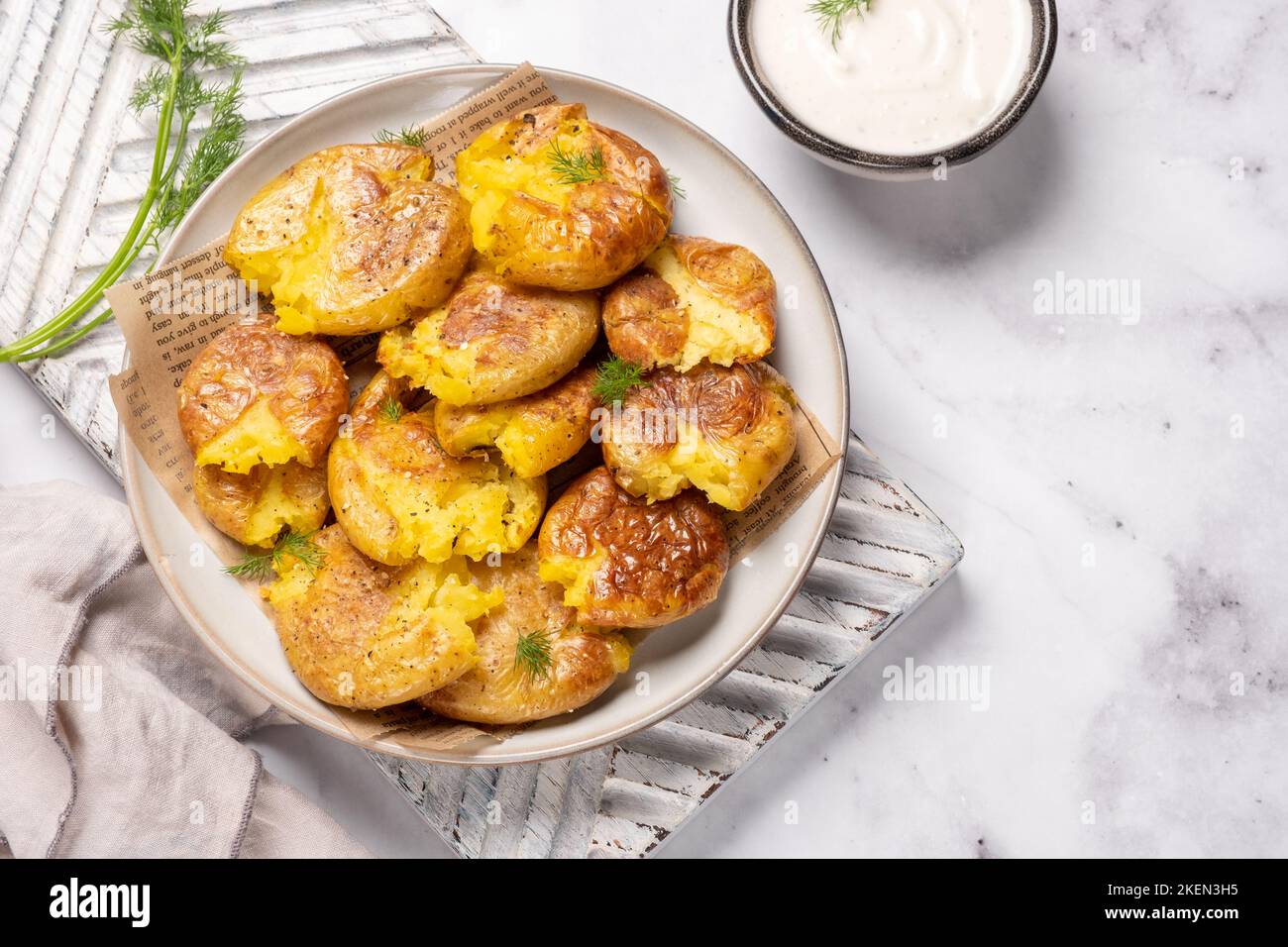smashed potato on parchment paper Stock Photo - Alamy