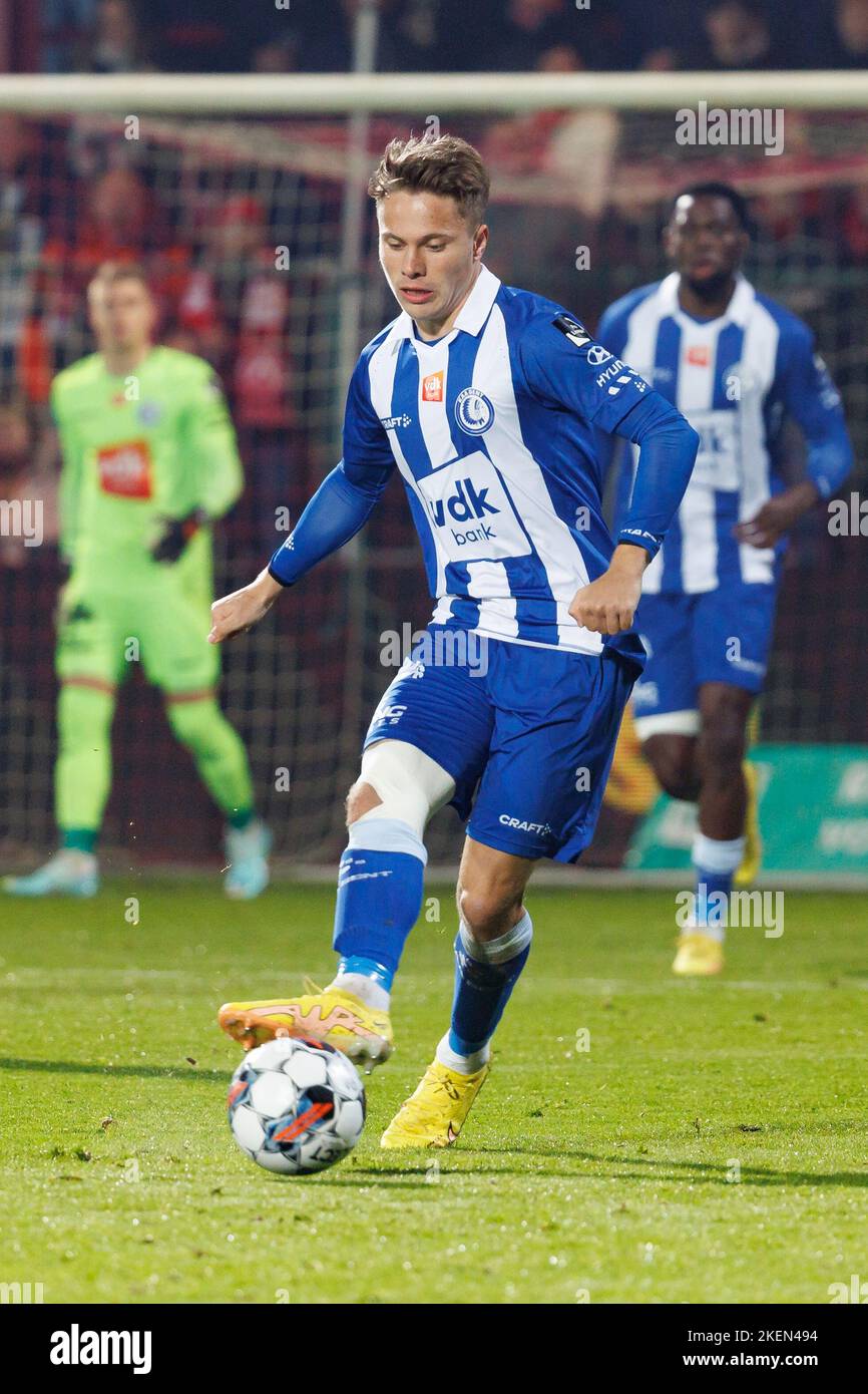 Gent's Matisse Samoise fight for the ball during a soccer match between ...