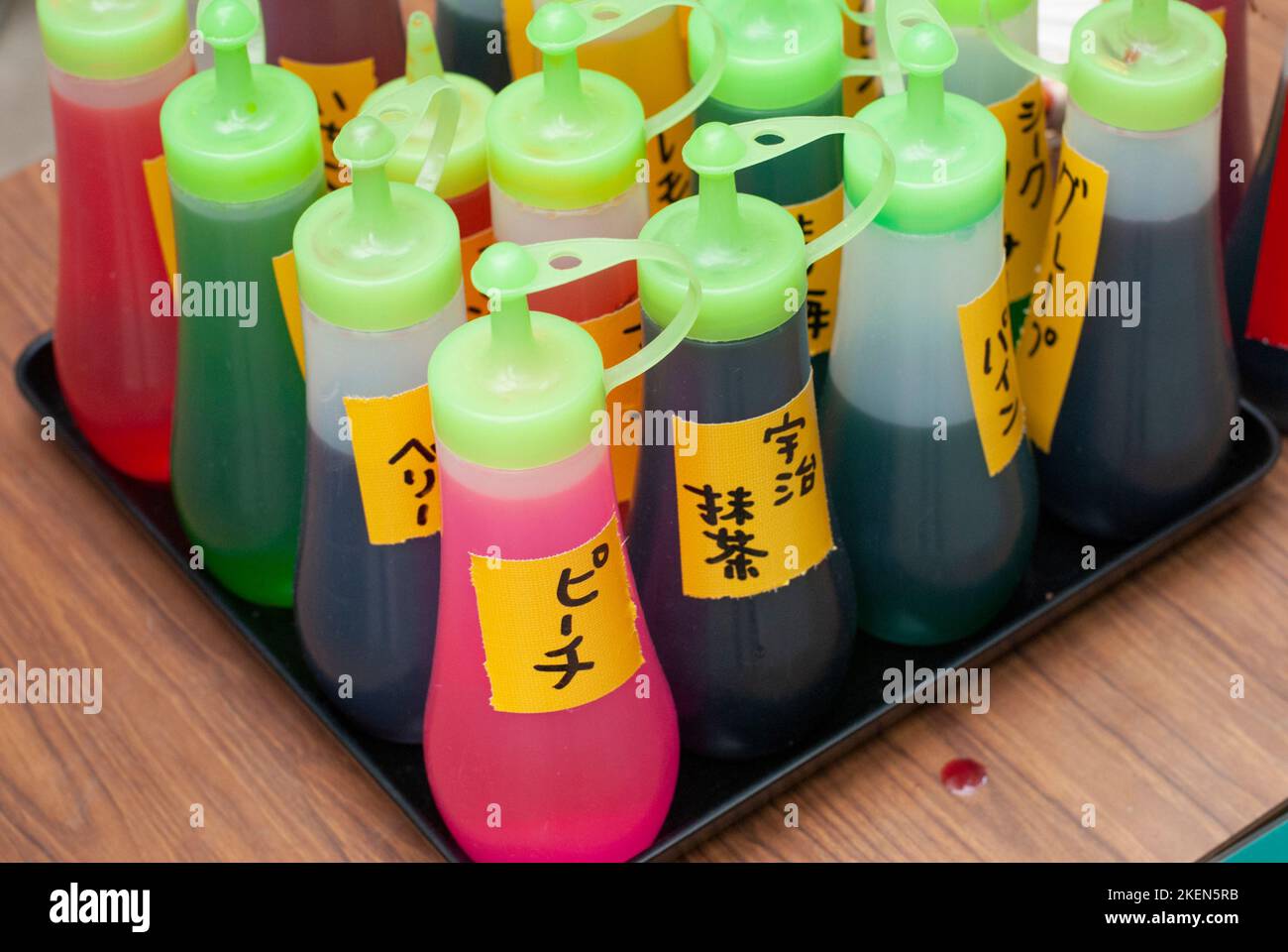 Japanese shave ice, or kakigori, syrups at a shaved ice stand, Tokyo ...