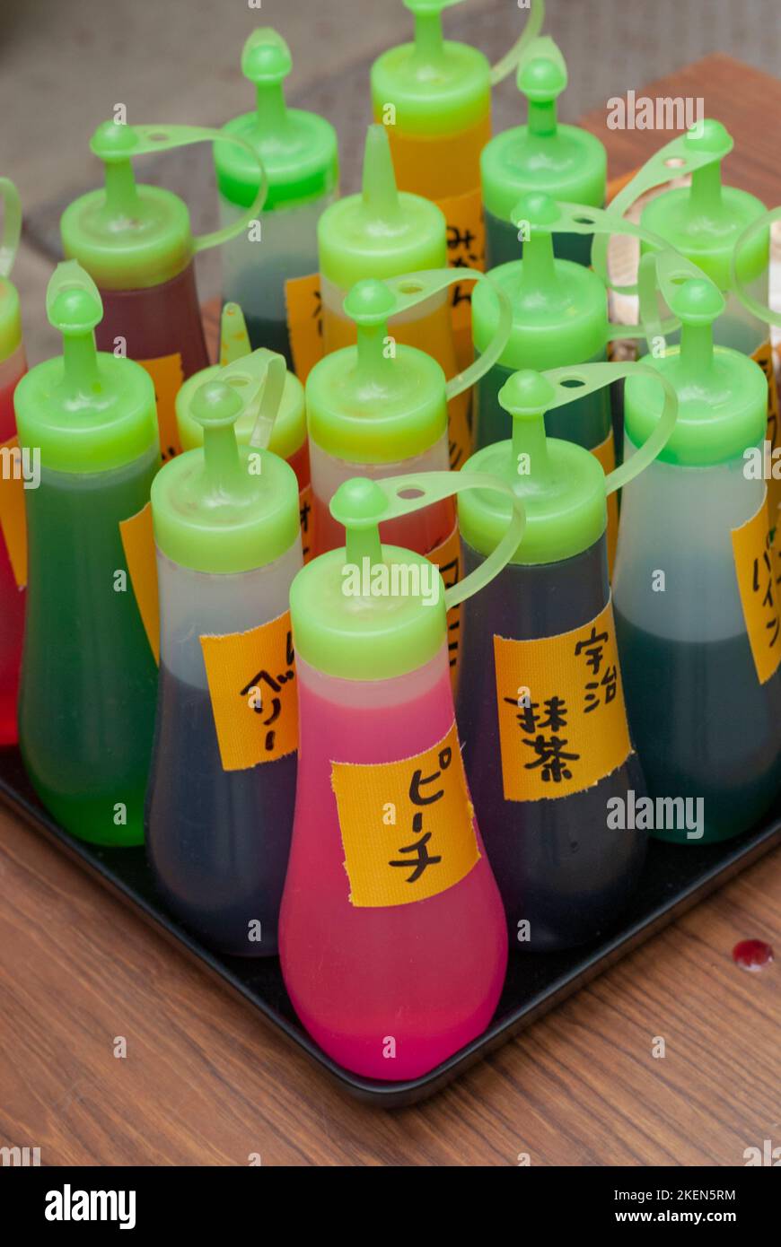 Japanese shave ice, or kakigori, syrups at a shaved ice stand, Tokyo ...