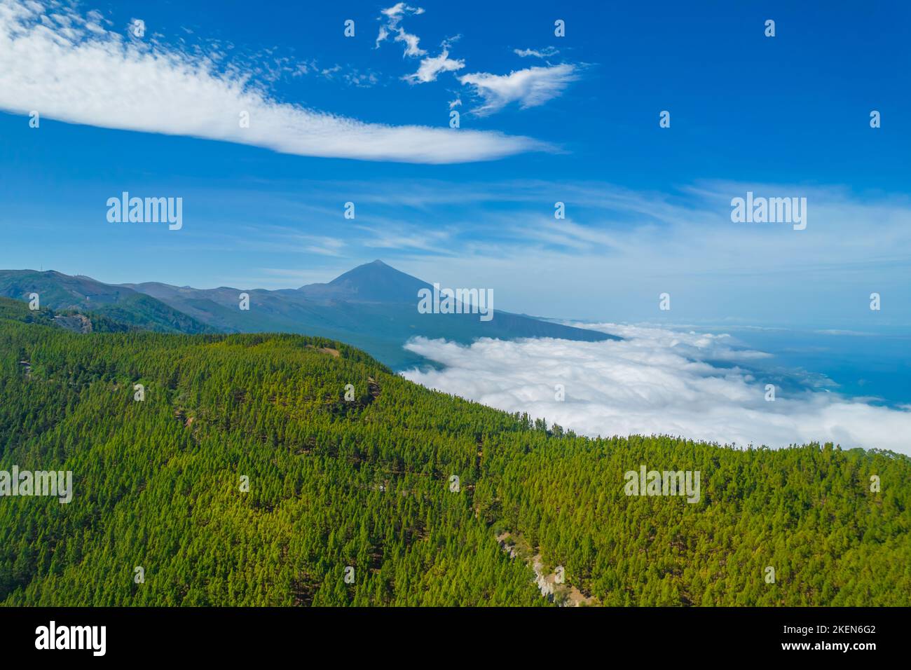 Aerial photo of mount Teide in the distance above the clouds. Volcano ...