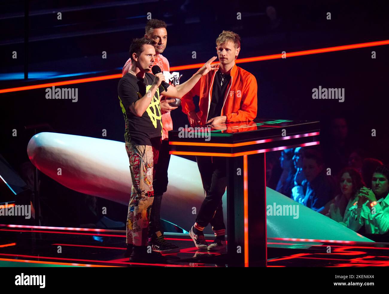 Matt Bellamy, Chris Wolstenholme and Dominic Howard of Muse on stage ...