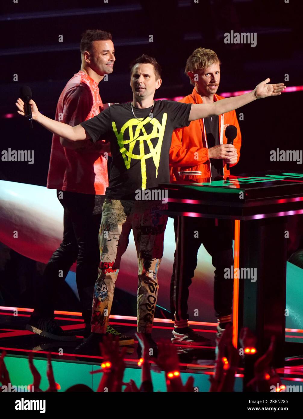 Chris Wolstenholme, Matt Bellamy and Dominic Howard of Muse on stage ...