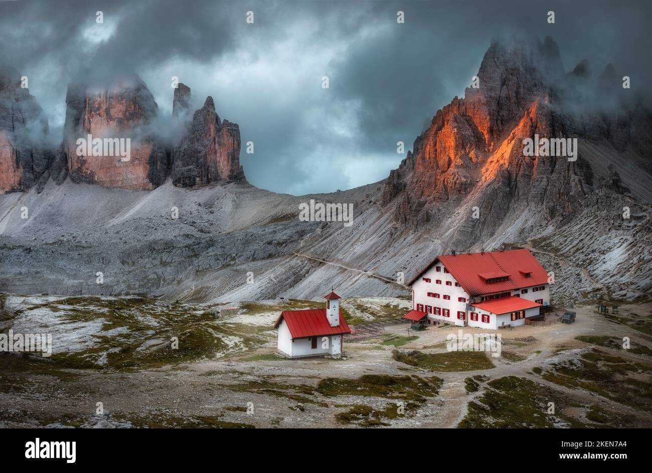 Mystical landscape with rocky mountains house and beautiful church at ...