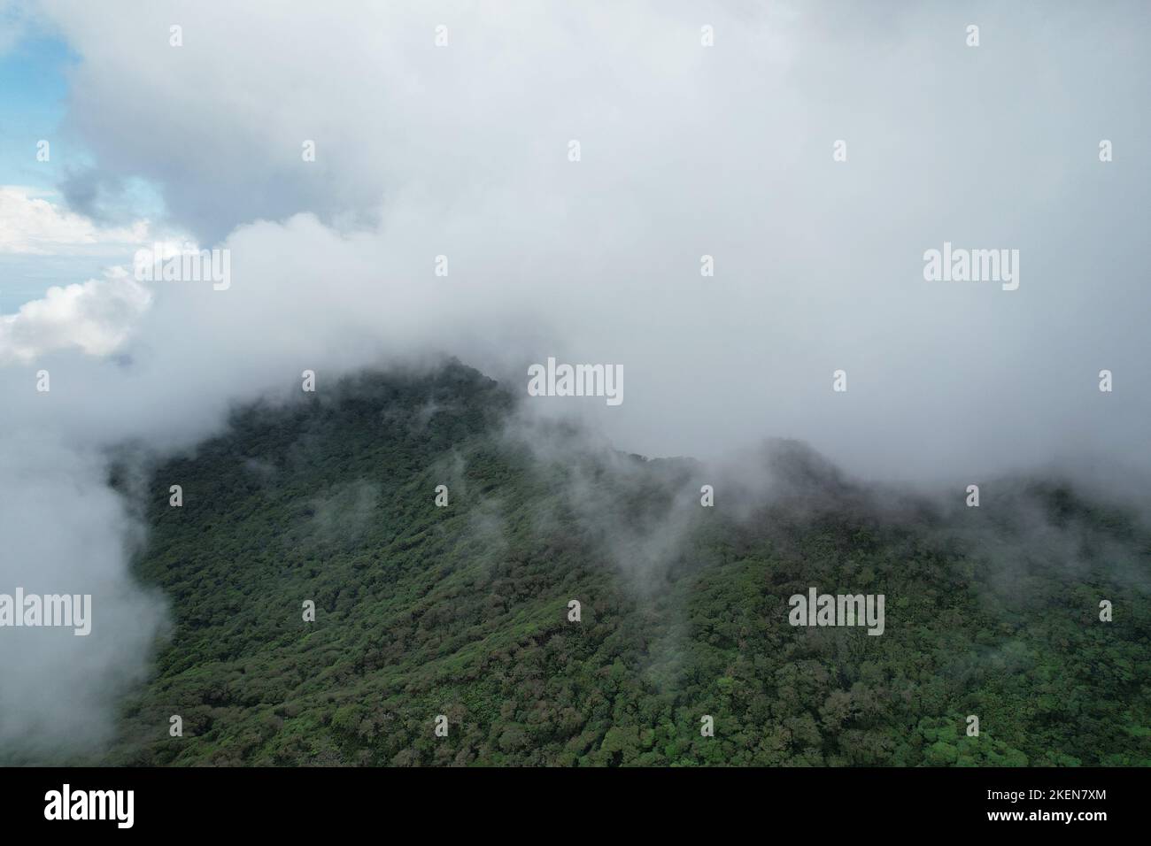 Fluffy clouds over Mombacho volcano in Nicaragua aerial drone view ...