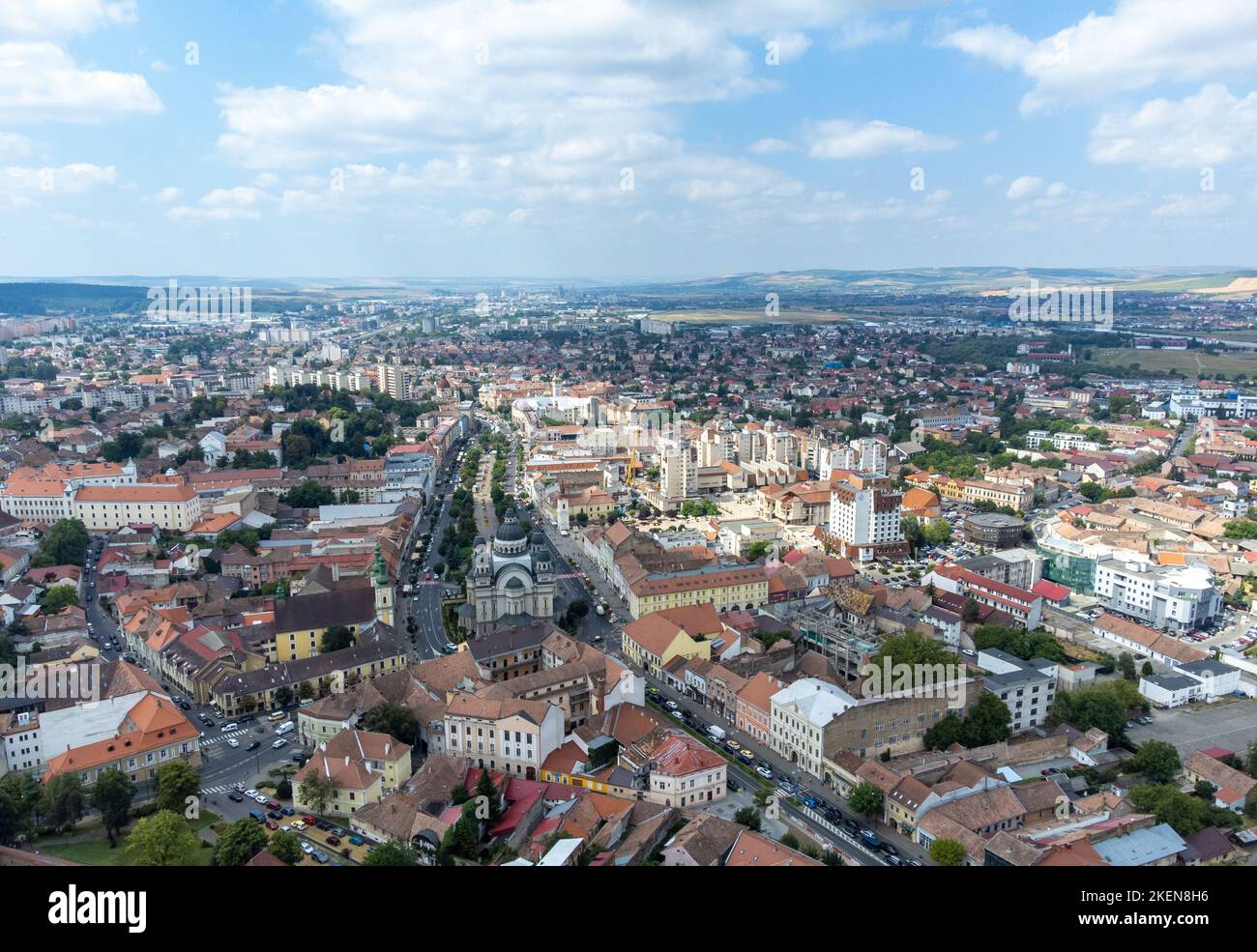 An aerial cityscape with buildings and street, Targu Mures city ...