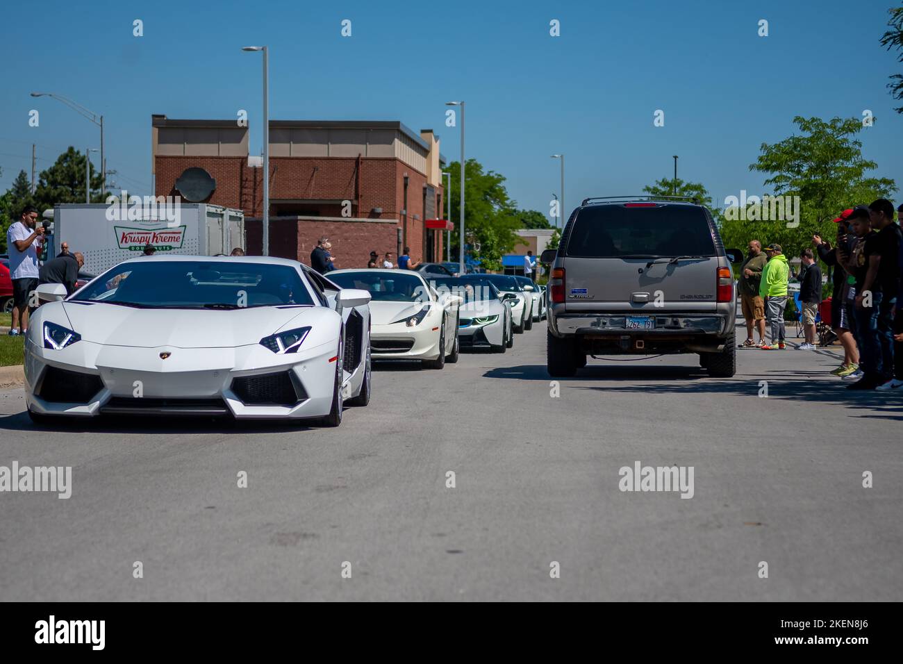A line of white Lamborghini Aventador cars on a street Stock Photo - Alamy