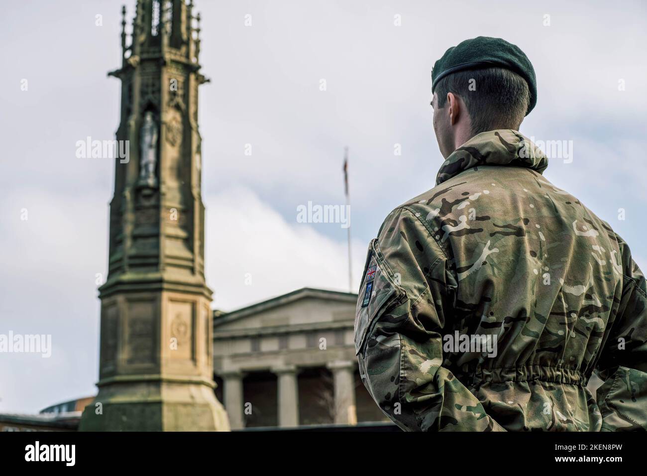 A member of the armed forces seen in front of the Hereford War Memorial ...