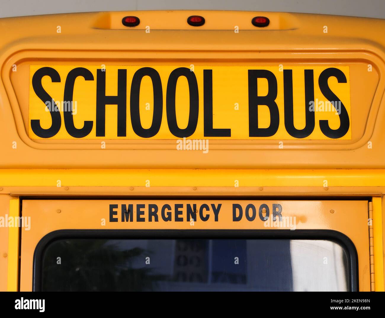A closeup shot of the traditional yellow lettering for school bus with ...