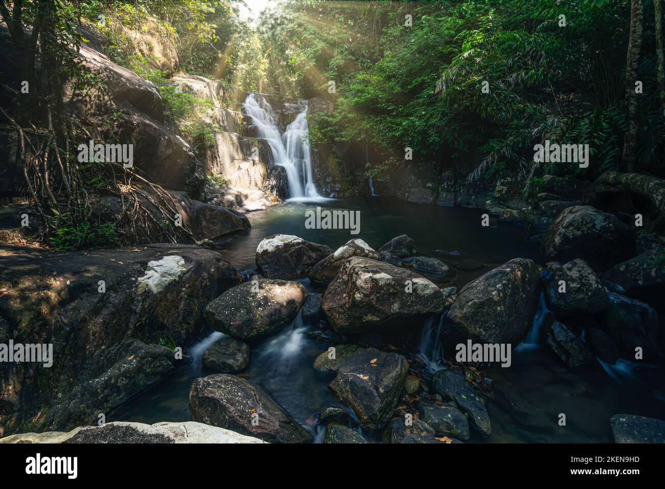 A waterfall flowing over rocks in Khlong Pla Kang, Wang Mi, Thailand ...