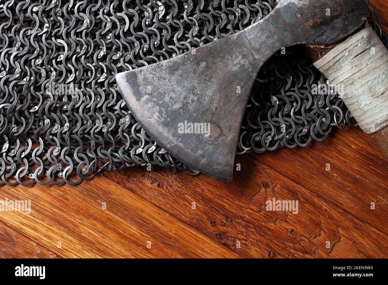 battle axe on chain mail armor background Stock Photo - Alamy