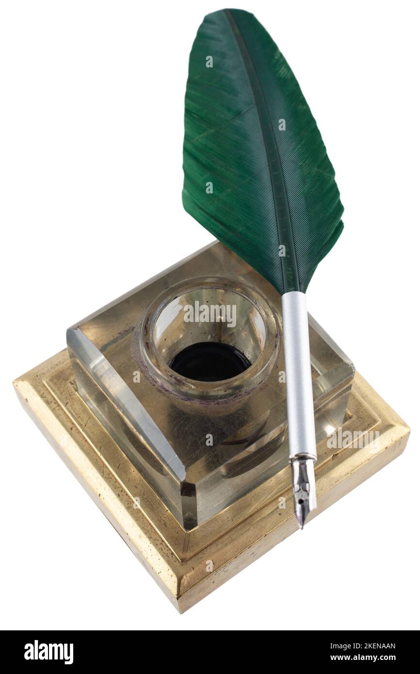 Old vintage feather quill with glass inkwell isolated on white ...