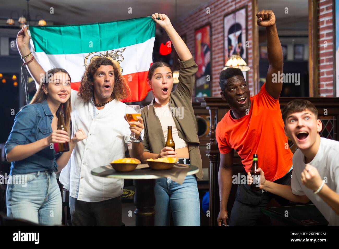 Iran sports fans supporting their favourite team in pub Stock Photo - Alamy
