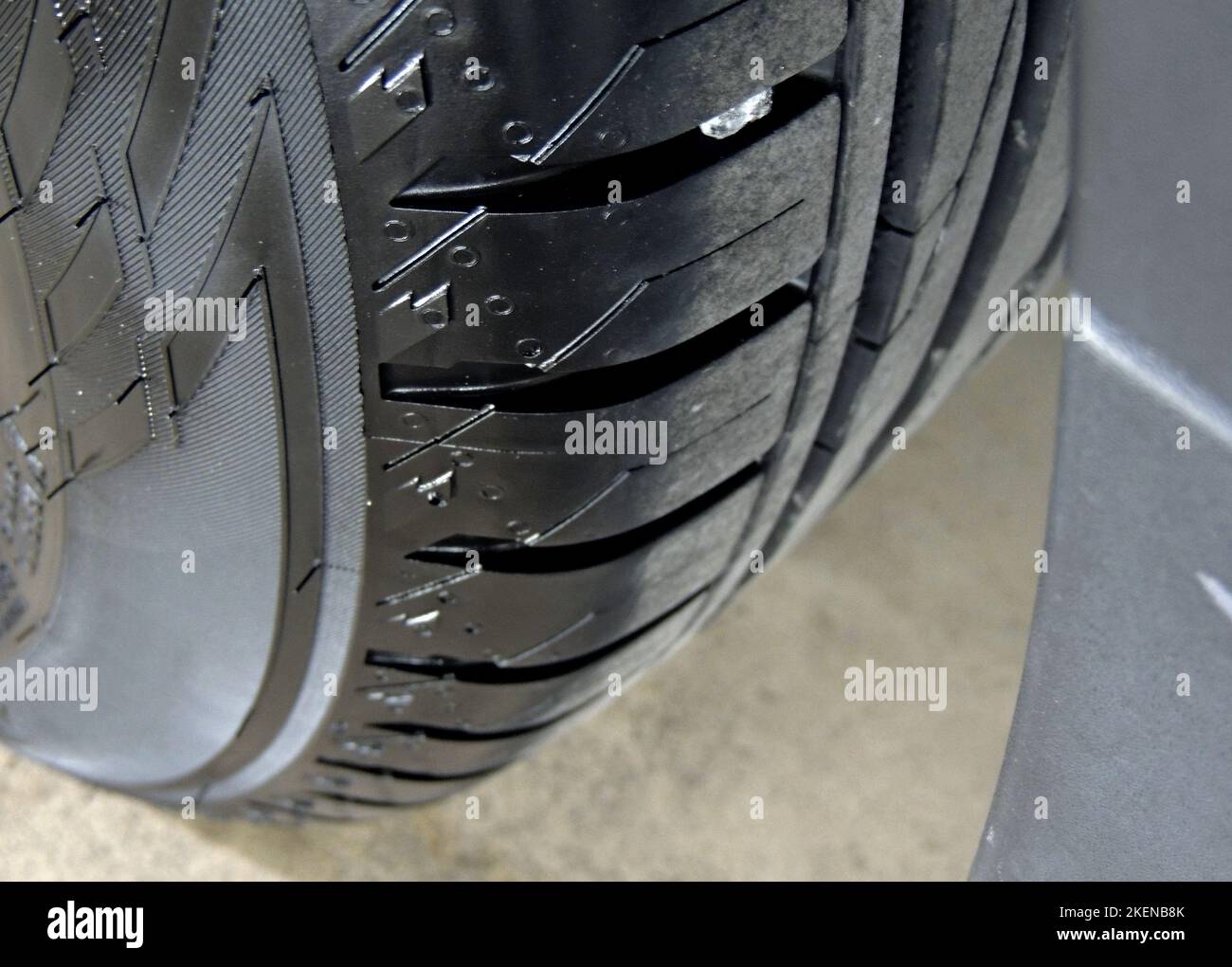Overhead view of cleaned car tire on the concrete floor close up Stock ...
