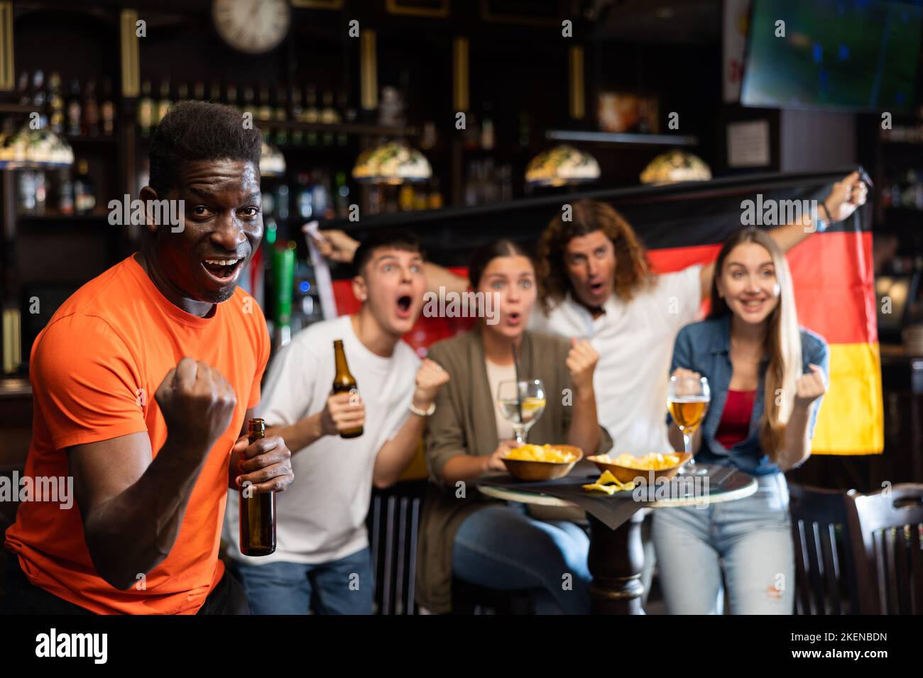 Excited african american man celebrating victory of favorite German ...