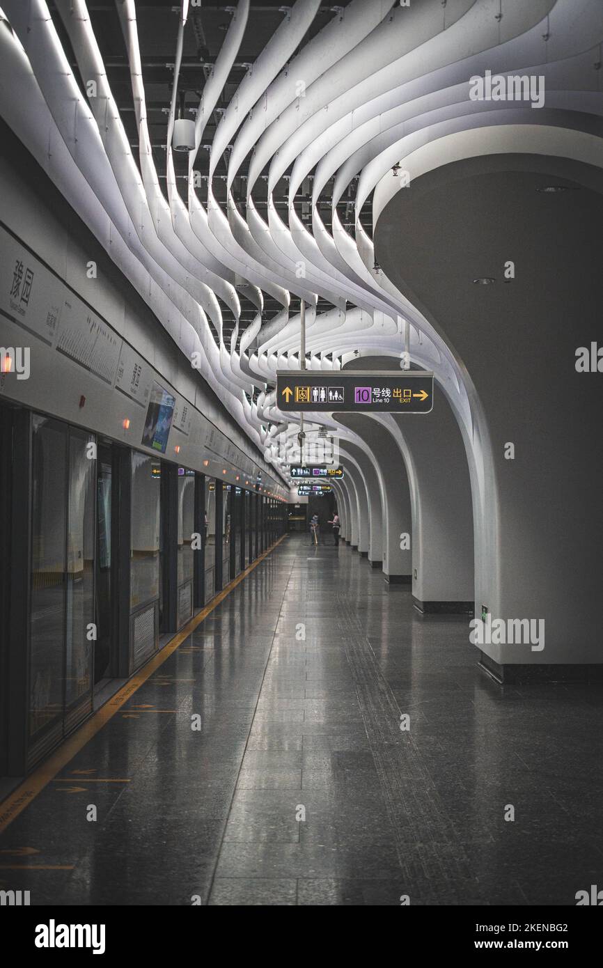 A vertical shot of the modern interior of Shanghai metro station in ...