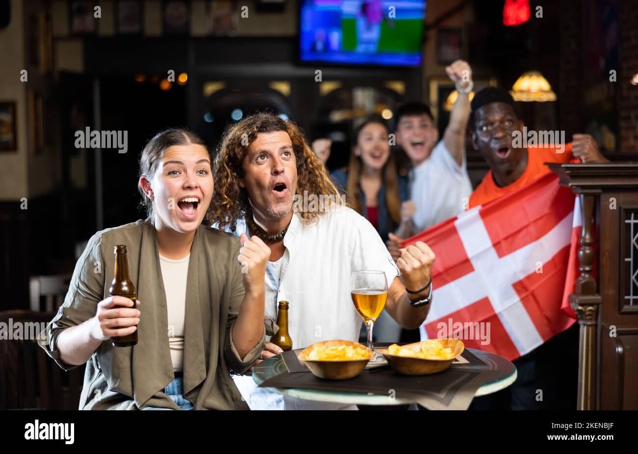 Denmark football team fans spending time in bar Stock Photo - Alamy