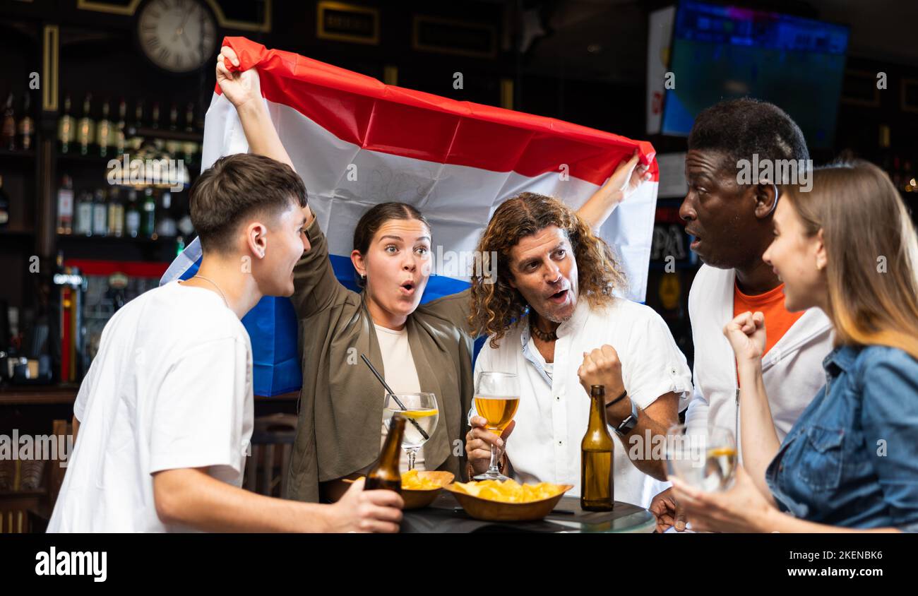 Fans with flag of Netherlands celebrate victory of their favorite team ...