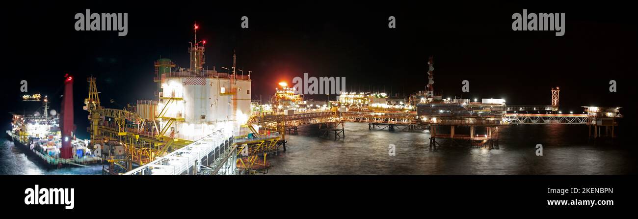 Silhouette of an offshore oil rig at night in the South China Sea Stock ...