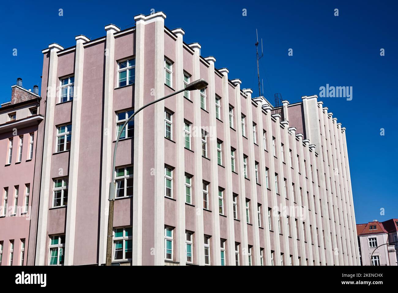 Facade of a modernist residential and office building in Poznan, Poland ...