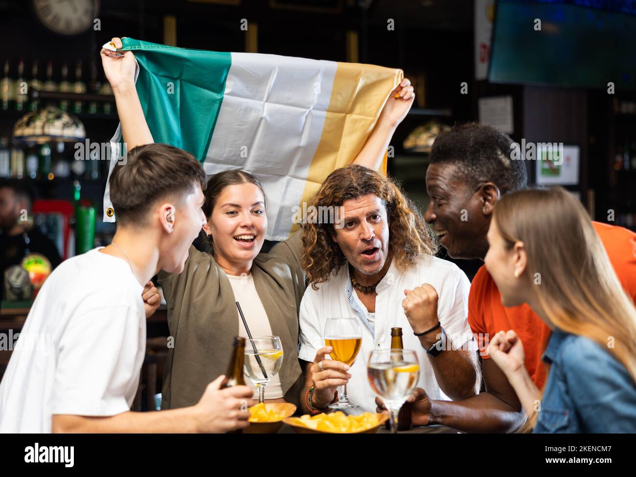 Emotional football fans rooting for favorite Ireland team in sports bar ...