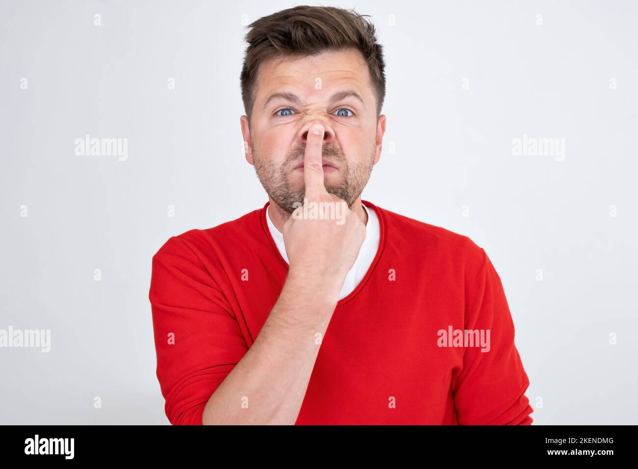 man with shirt making expressive and silly gestures isolated on white ...