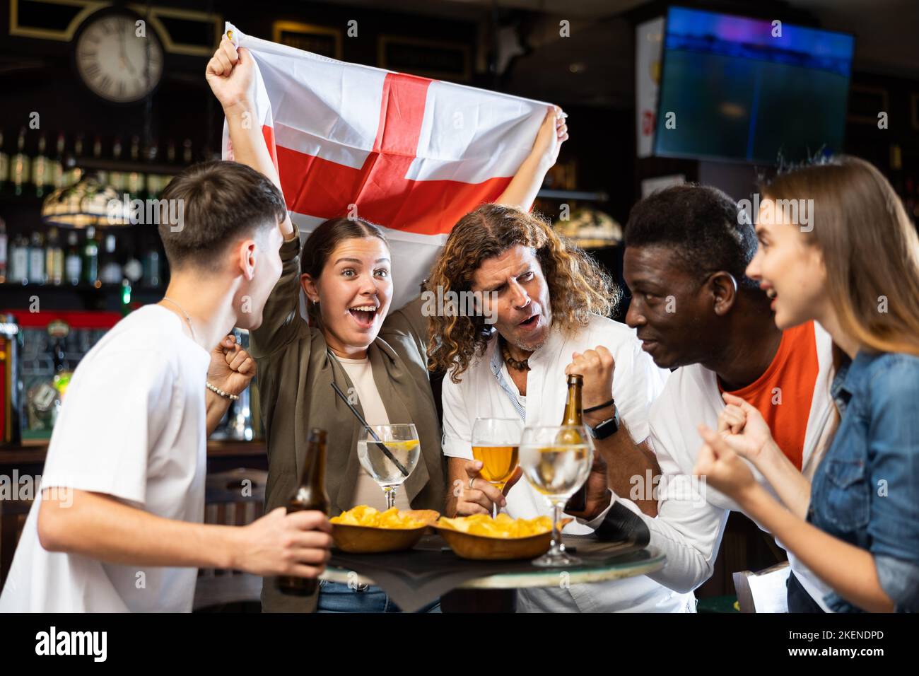 Group of England football team fans spending time in bar Stock Photo ...