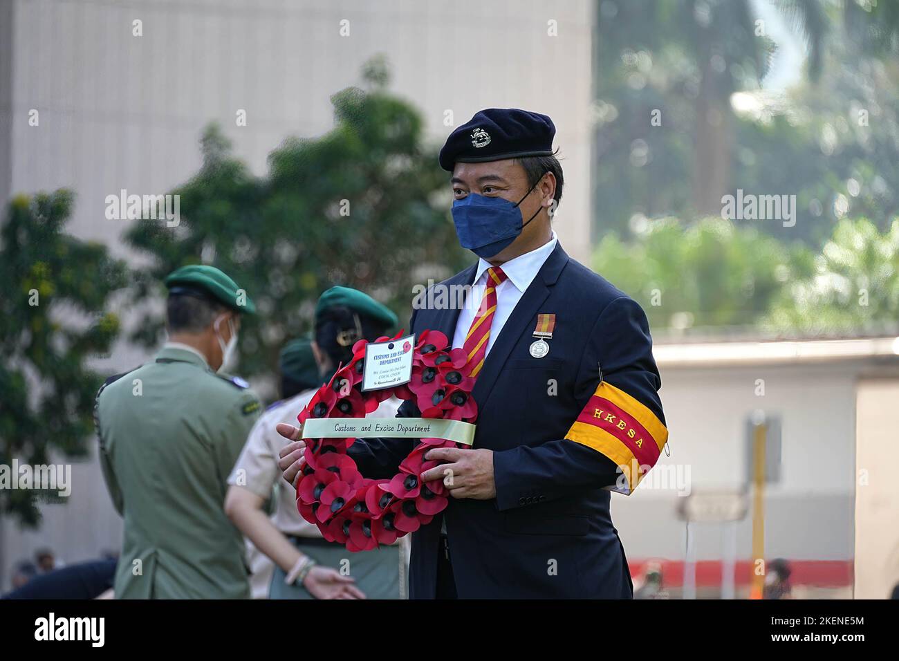 A man holds a wreath during the remembrance day. Hundreds of people ...