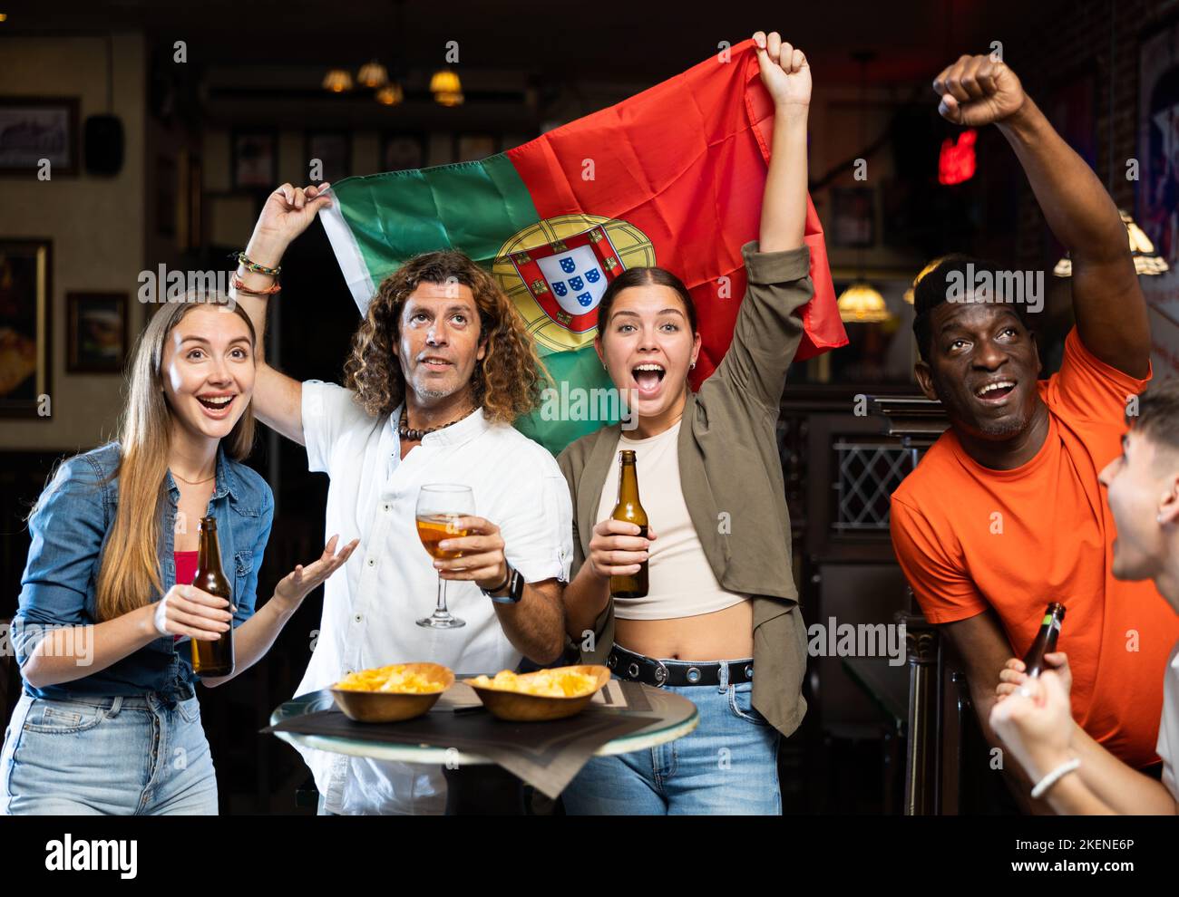 Football fans waving in pub hi-res stock photography and images - Alamy