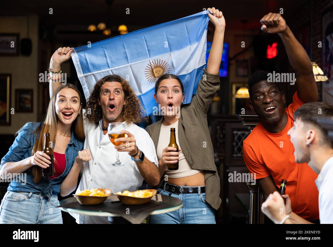 Happy fans celebrating the victory of Argentinean team in bar Stock ...