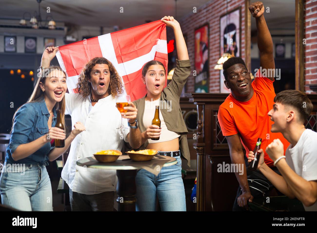 Danish fans scream with joy in beer bar. Denmark win Stock Photo - Alamy