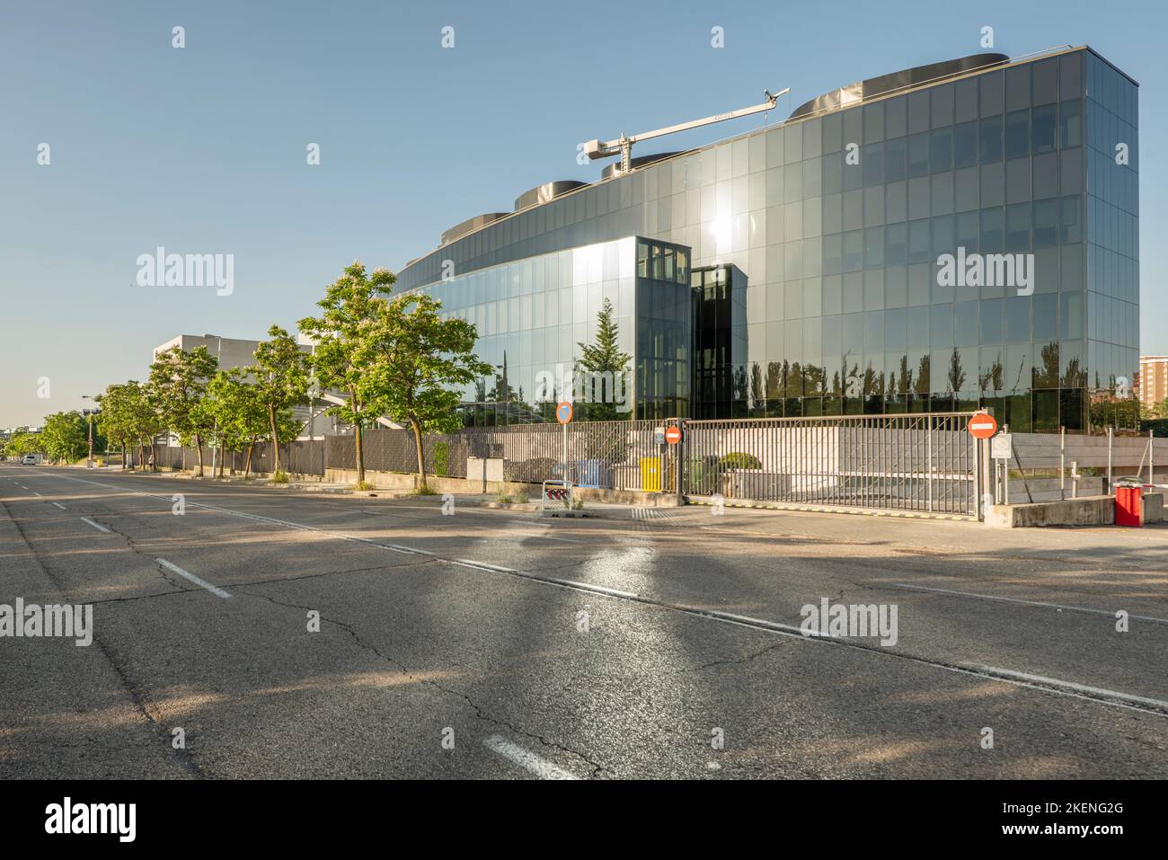 facade of an office building covered in shiny looking steel and glass ...