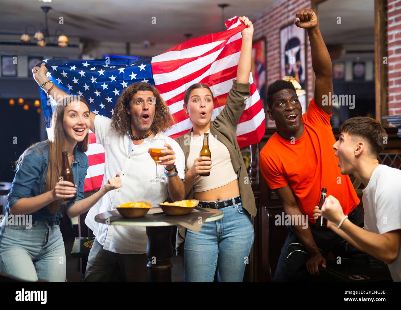 Group of American football fans cheering for favorite team in sports ...