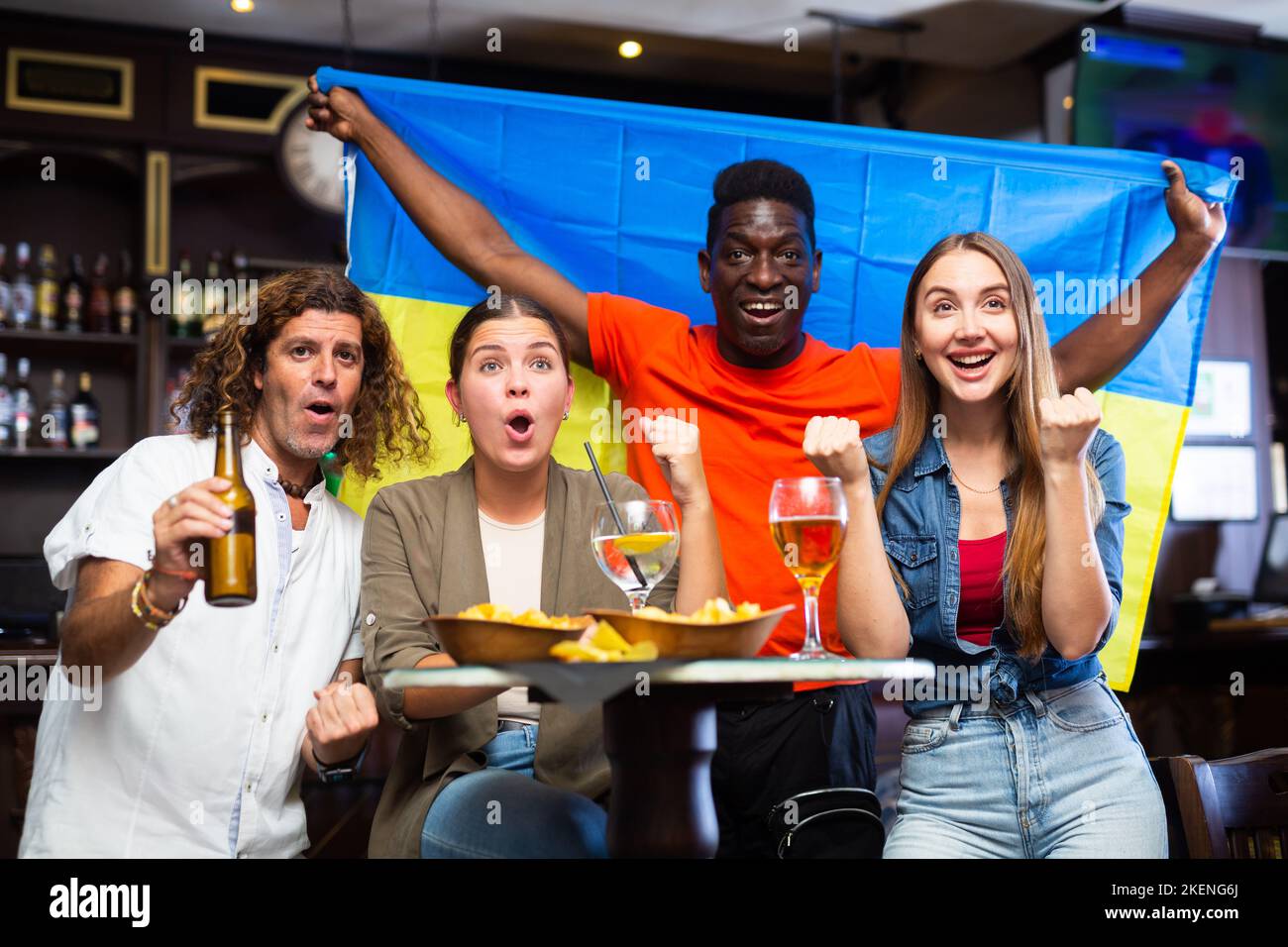 Football fans waving in pub hi-res stock photography and images - Alamy