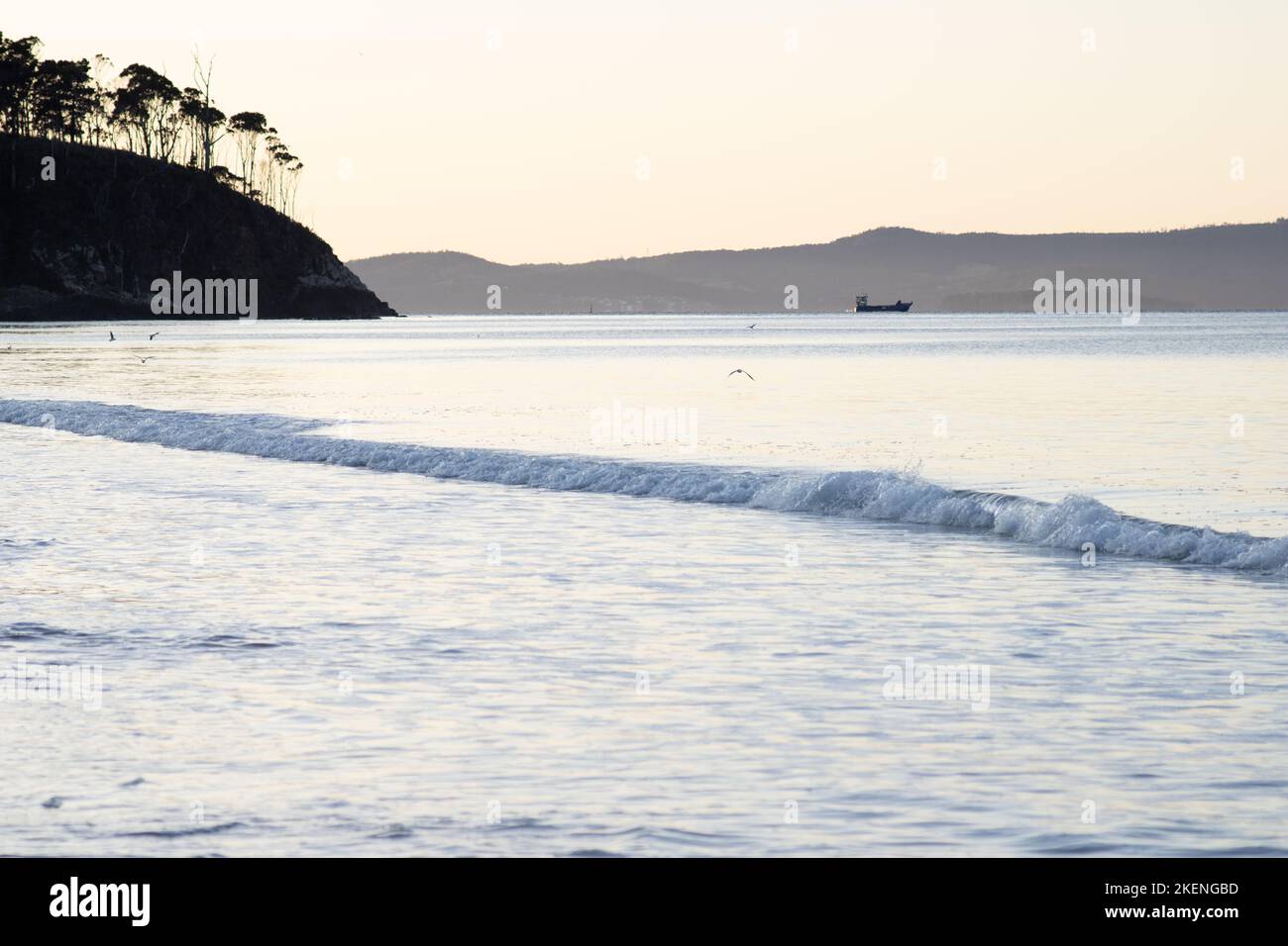 A roaring beach during the morning sunrise Stock Photo - Alamy