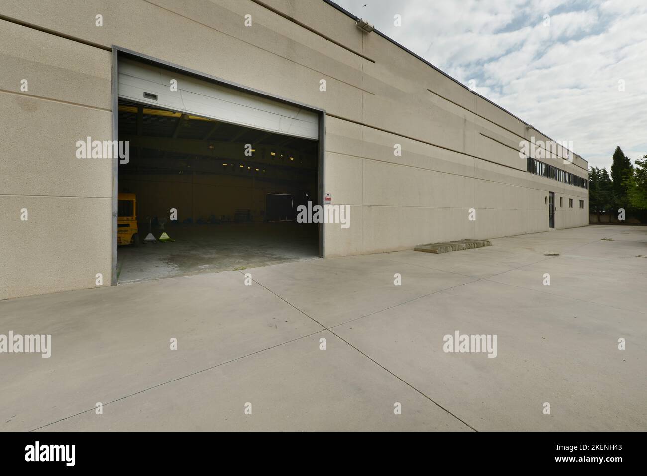 Industrial building facade made of cement and concrete wall with metal ...