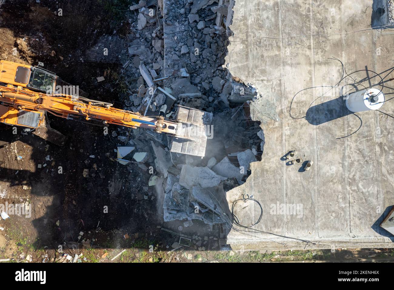 Excavator demolishing barracks for a new construction project Stock ...