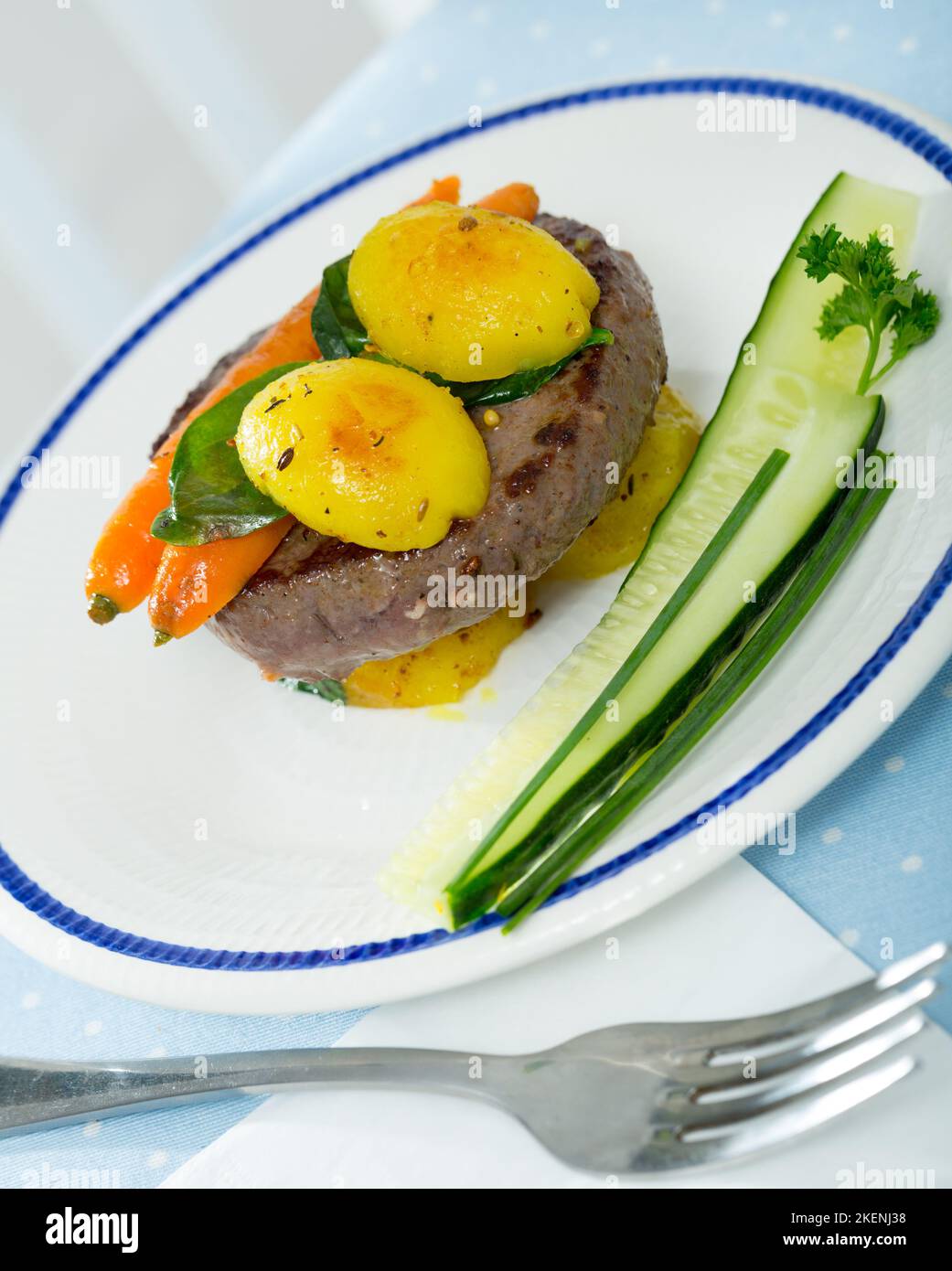 Beef rissole with new potatoes and carrot Stock Photo - Alamy