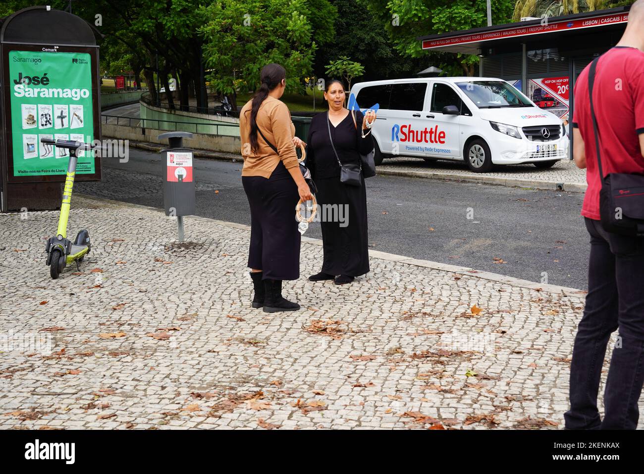 Lisbon, Portugal - September 2022: Romani women selling jewellry to ...