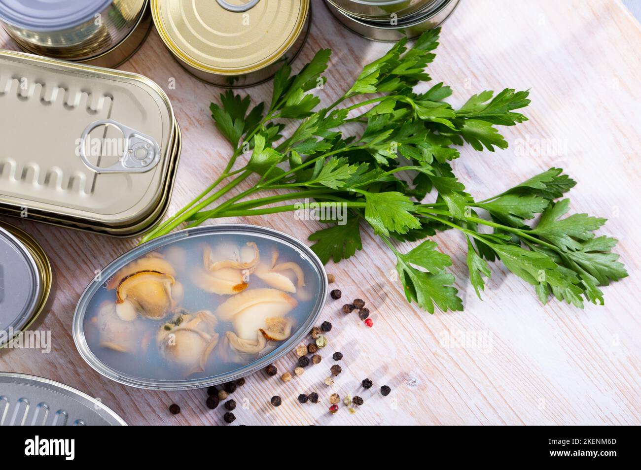 Tin can with sea shellfish in its own juice, closeup Stock Photo - Alamy