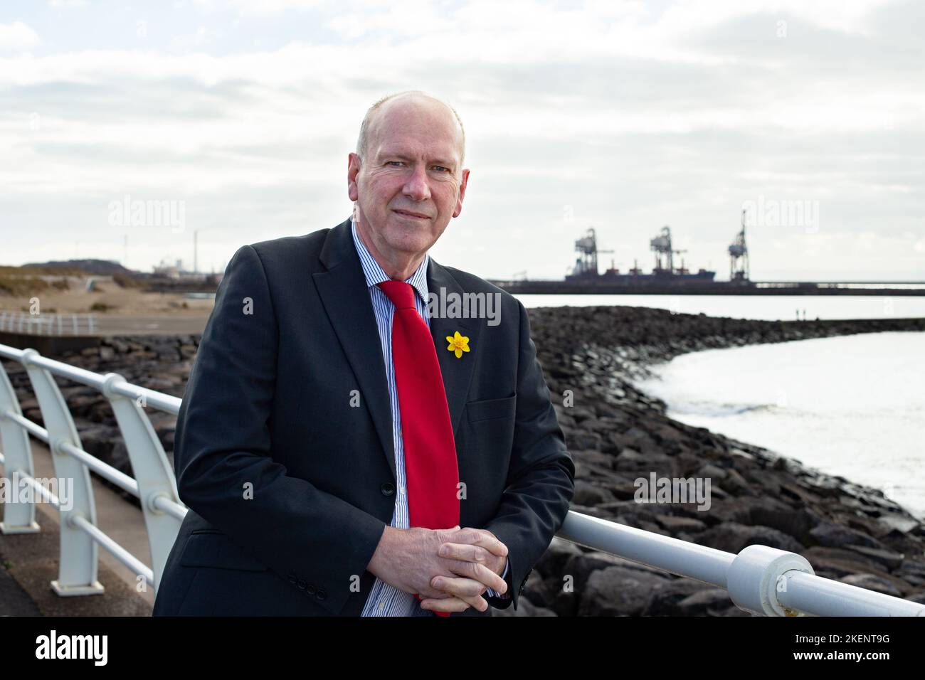 David Rees MS, standing on Aberavon Beach, in-front of the three ...