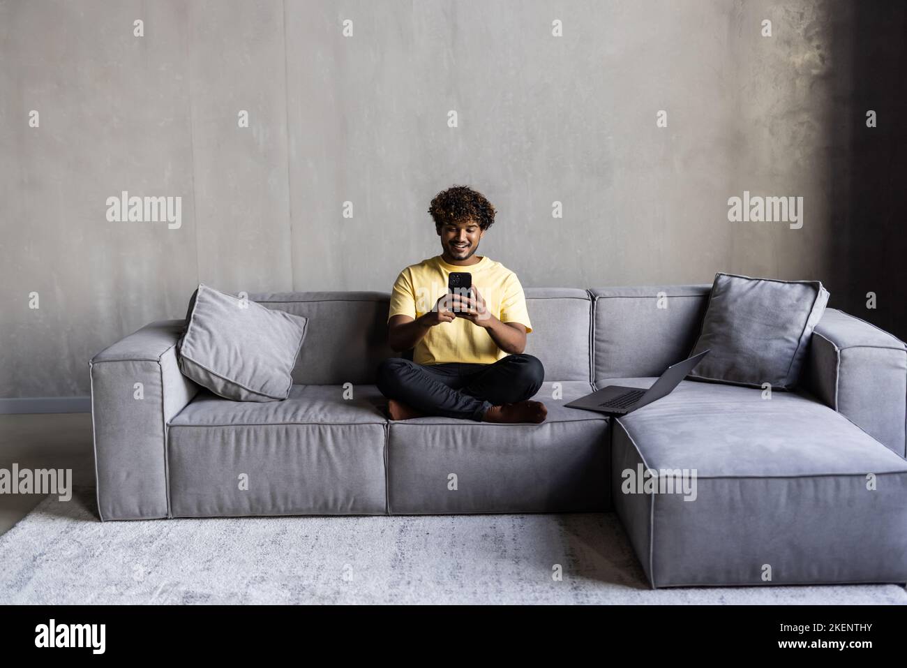 Young indian man scrolling hi-res stock photography and images - Alamy