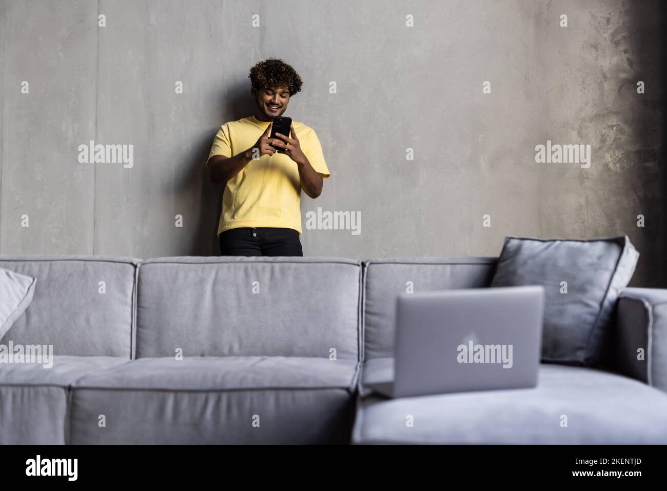 Young indian man scrolling hi-res stock photography and images - Alamy