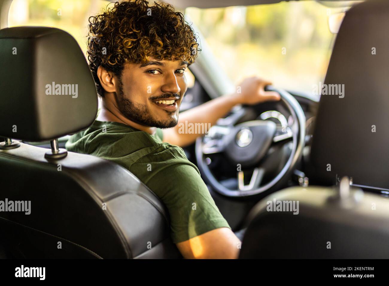 Side view of asian man driving car Stock Photo - Alamy
